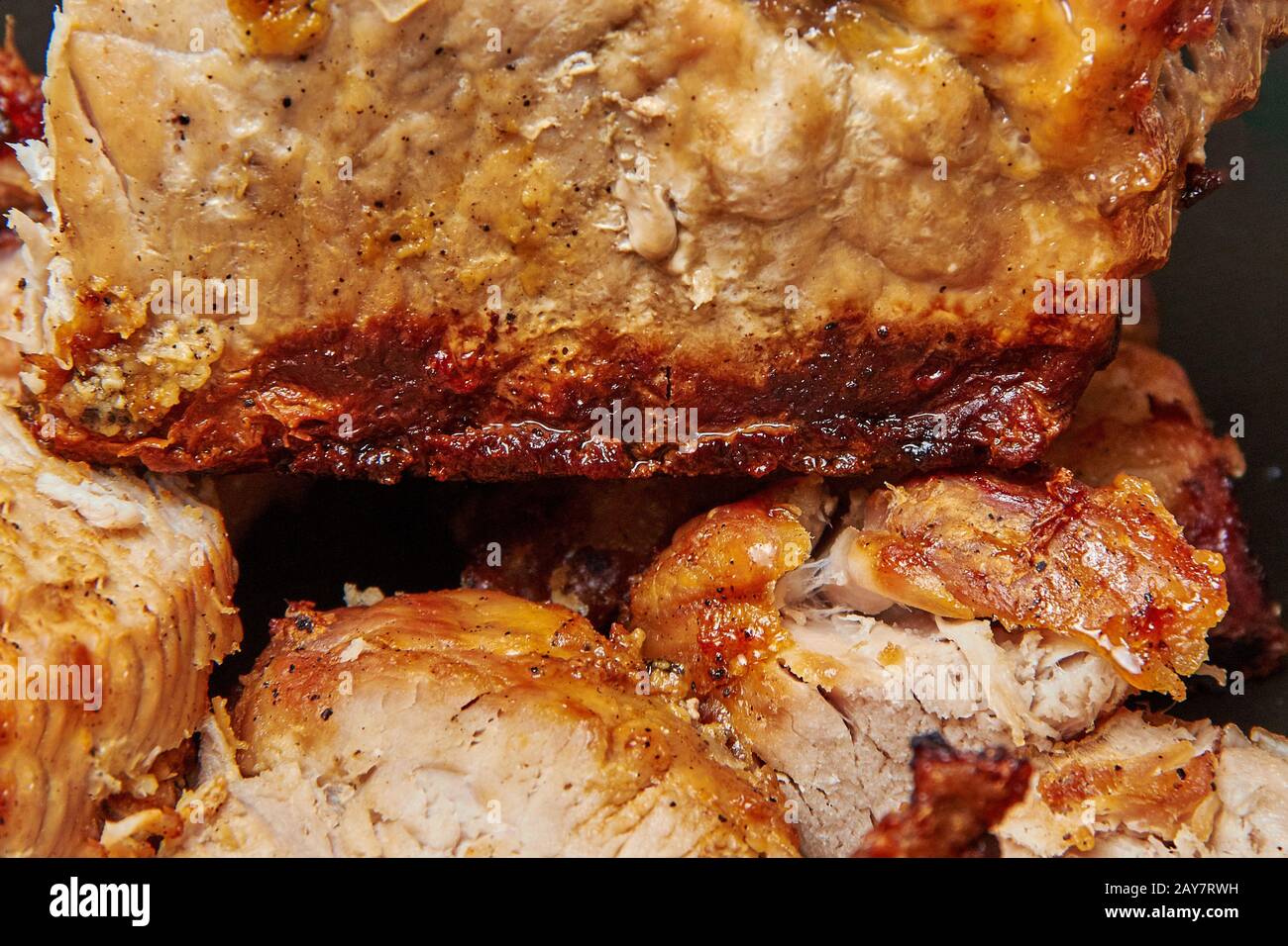 baked meat cut into pieces close up photo Stock Photo - Alamy