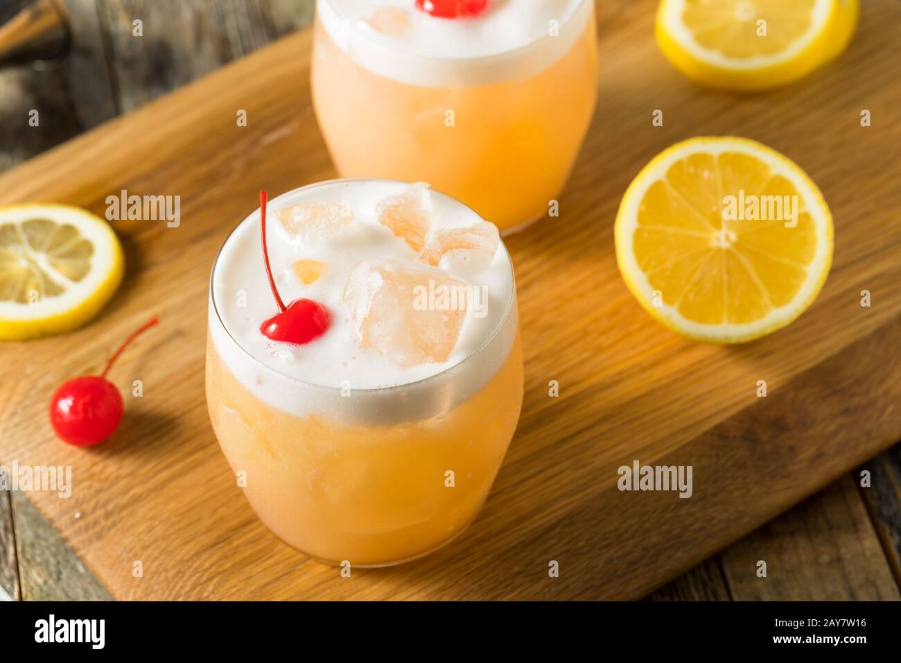 Refreshing Raki Vodka Sour Cocktail with a Cherry Stock Photo - Alamy