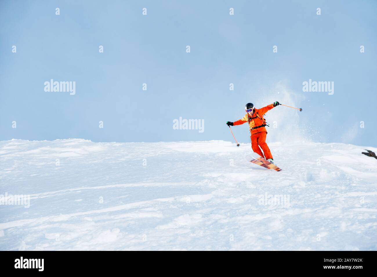 Ski athlete in a fresh snow powder rushes down the snow slope Stock ...
