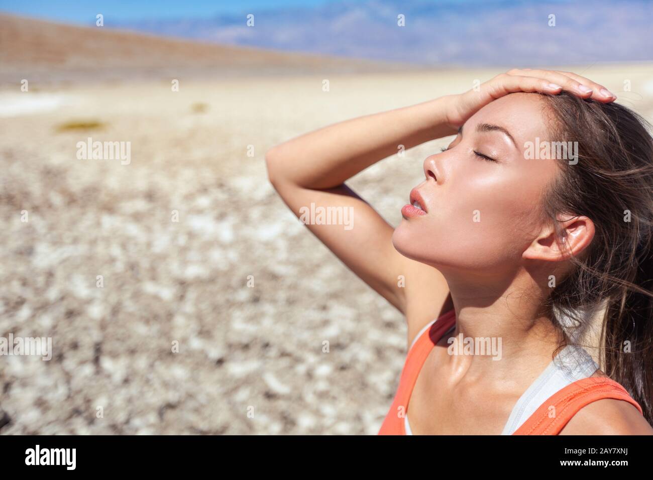 Heat stroke tired dehydrated girl under the desert sun hot temperature ...