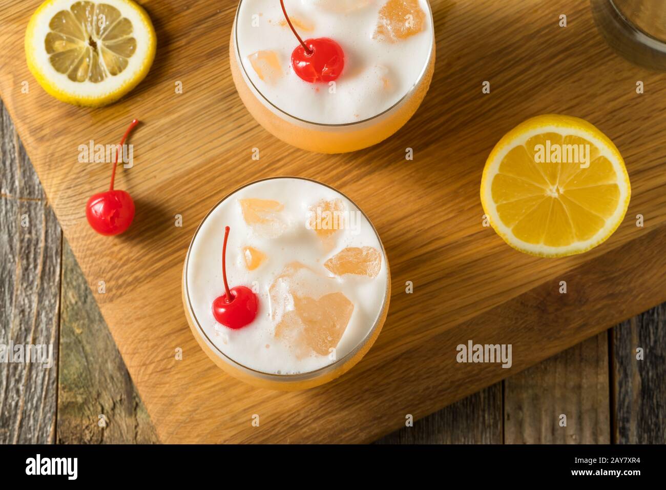 Refreshing Raki Vodka Sour Cocktail with a Cherry Stock Photo - Alamy
