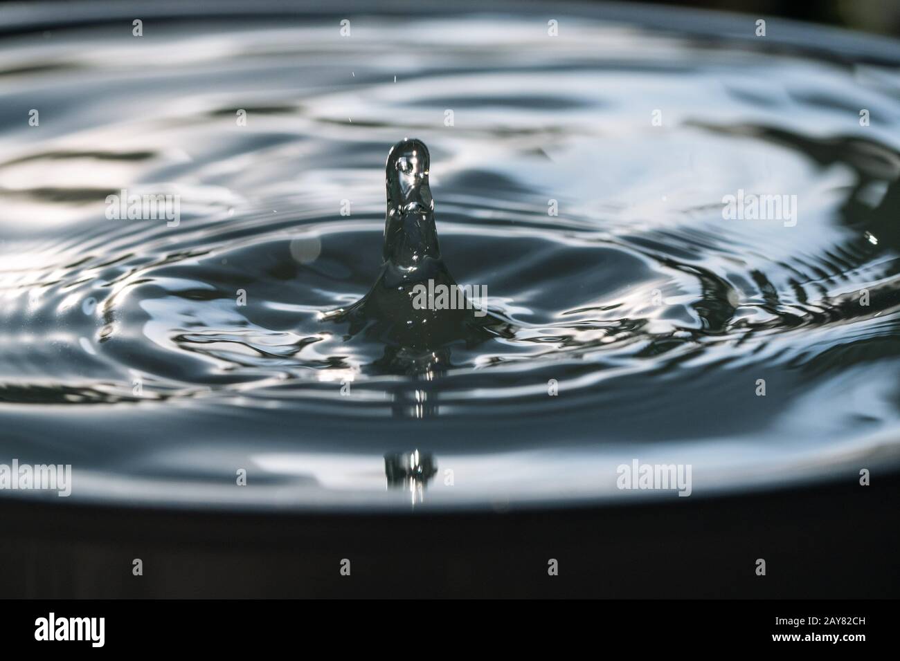Water Drop splash with sun Stock Photo - Alamy
