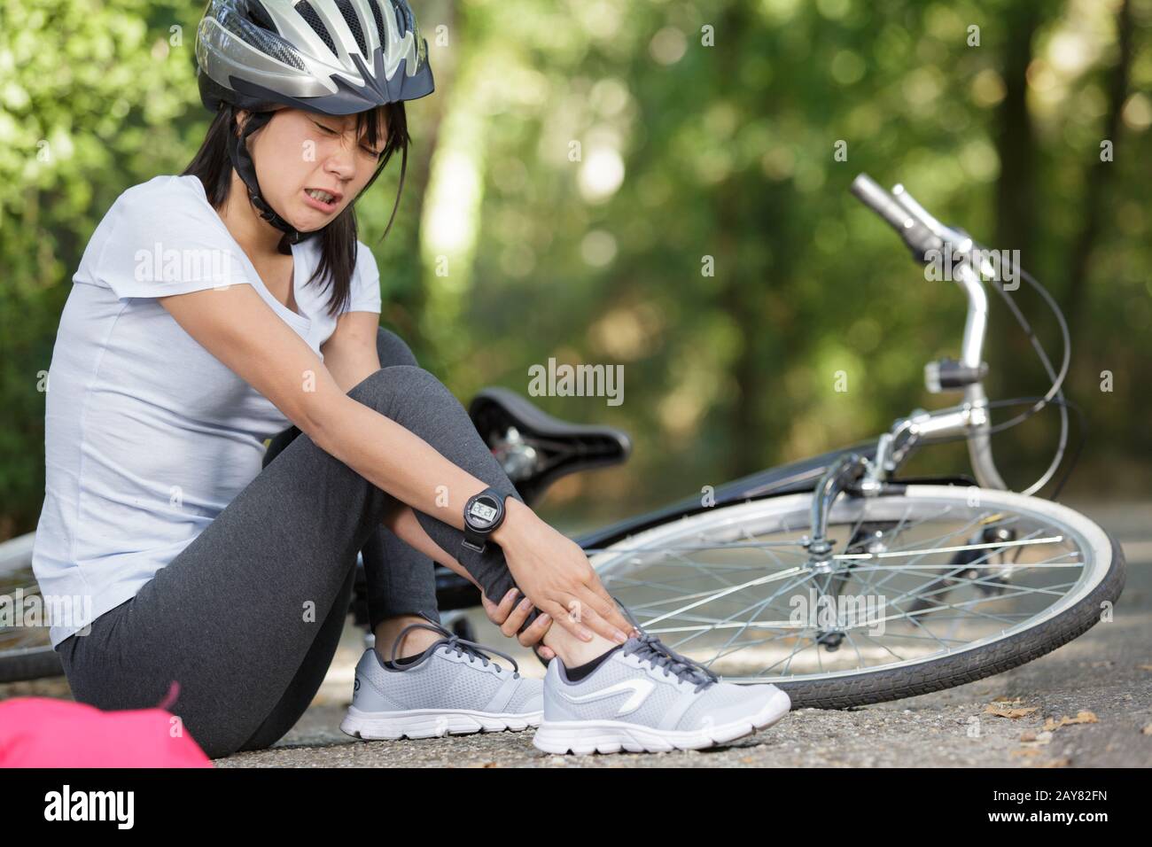 woman fell off the bike Stock Photo - Alamy