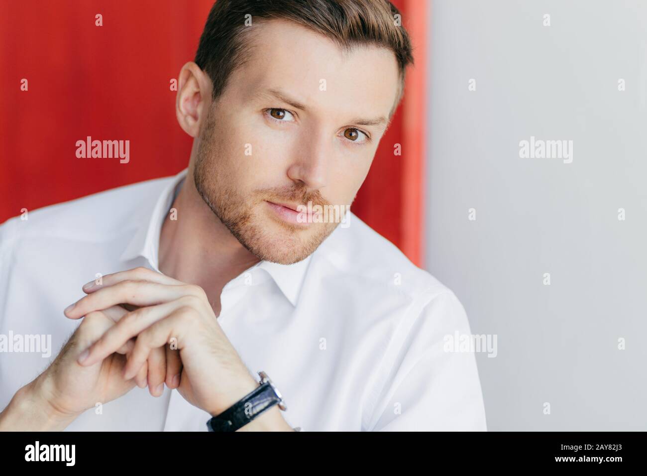 Cropped shot of serious young male CEO or company owner, has success ...