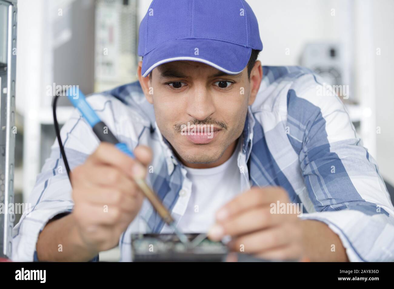 Repairman testing circuit board hi-res stock photography and images - Alamy