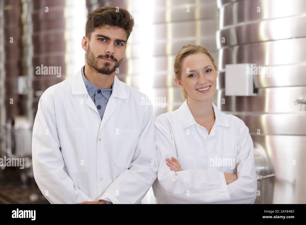 the beverage factory team posing Stock Photo - Alamy