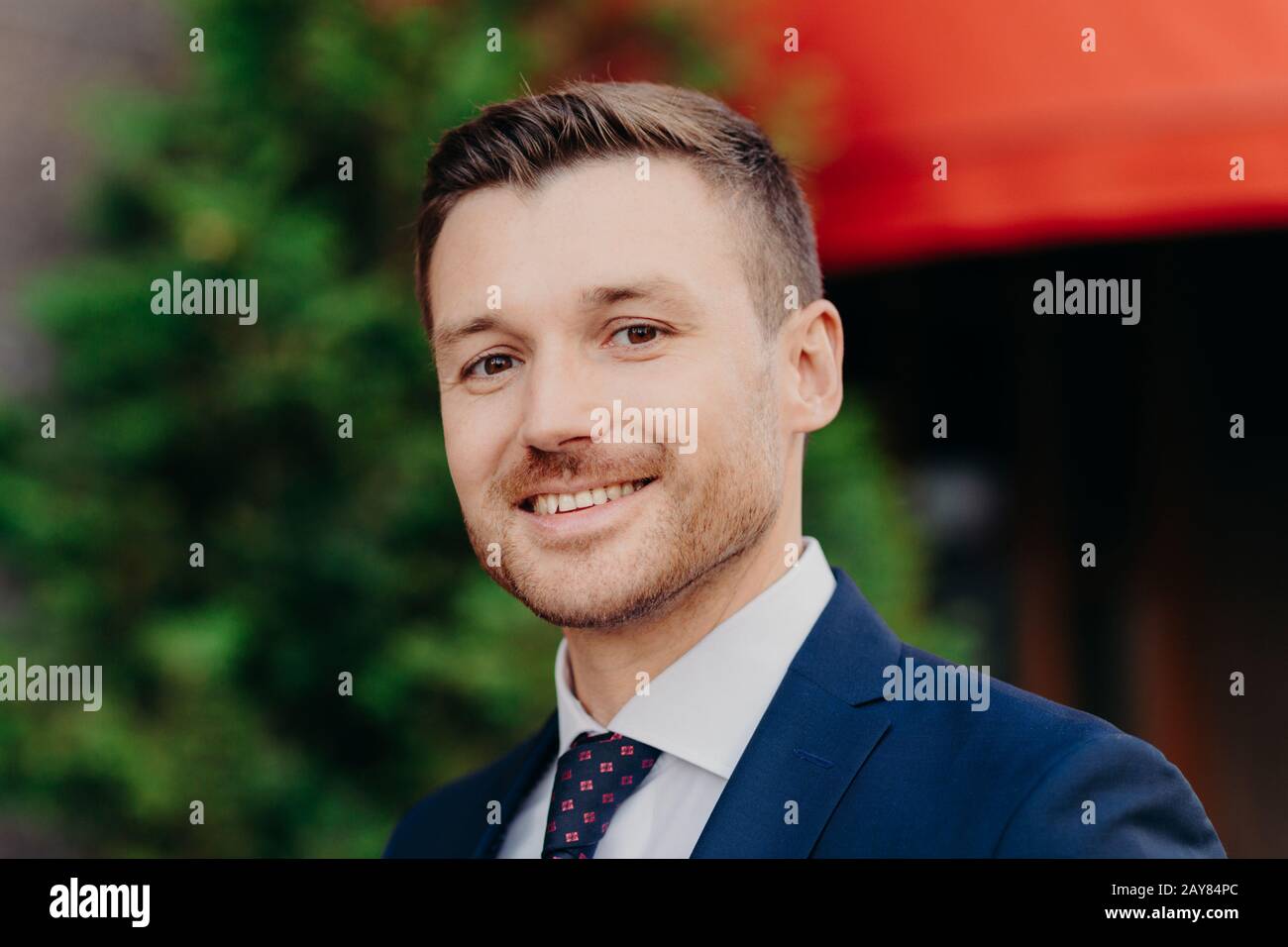 Close up portrait of handsome attractive male with gentle smile ...