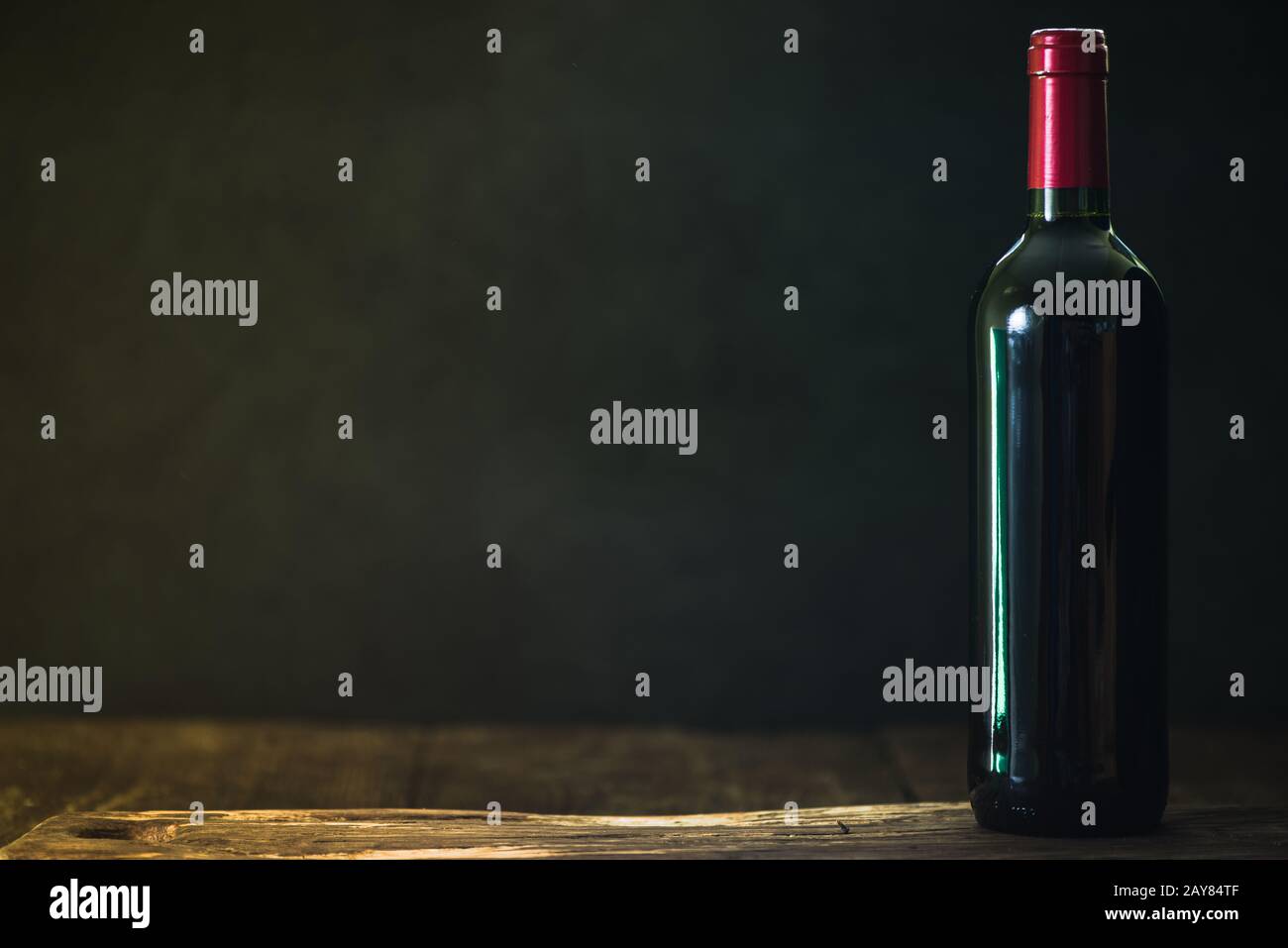 Red wine bottle in traditional cellar Stock Photo - Alamy