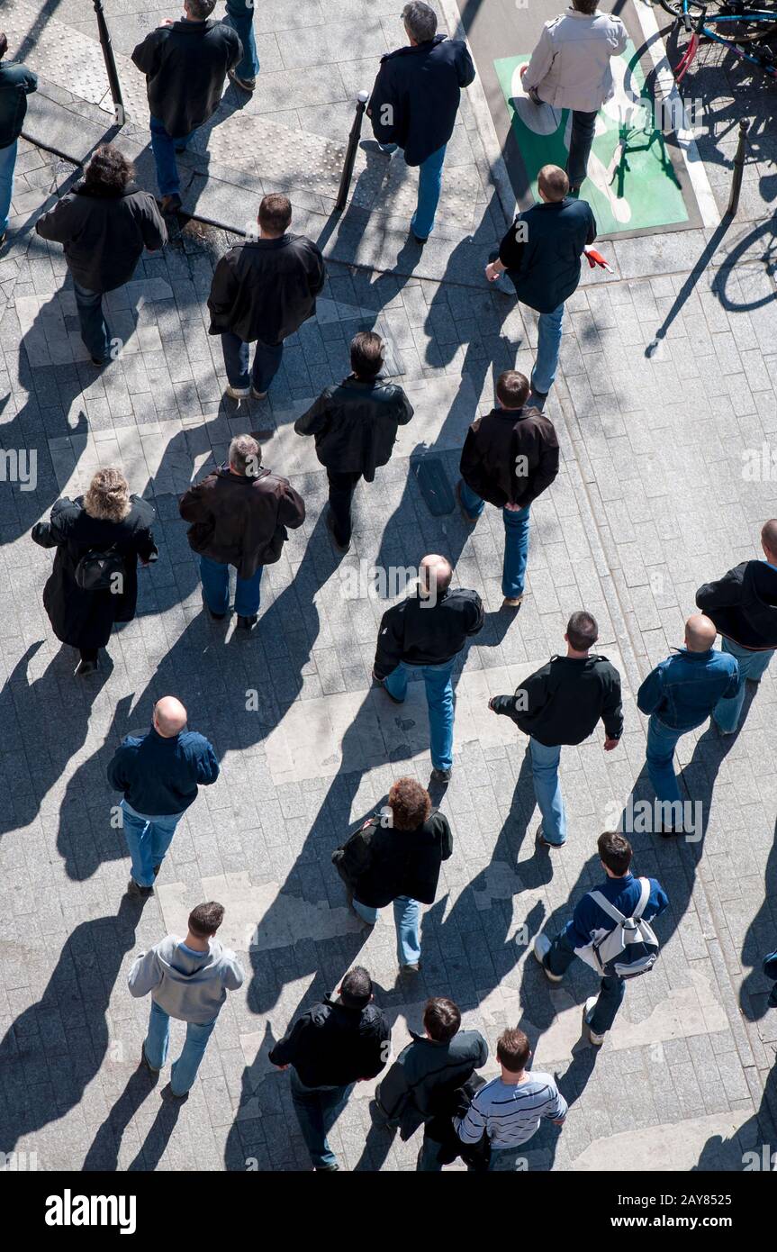 Overhead view of crowd of unrecognizable pedestrians walking on ...
