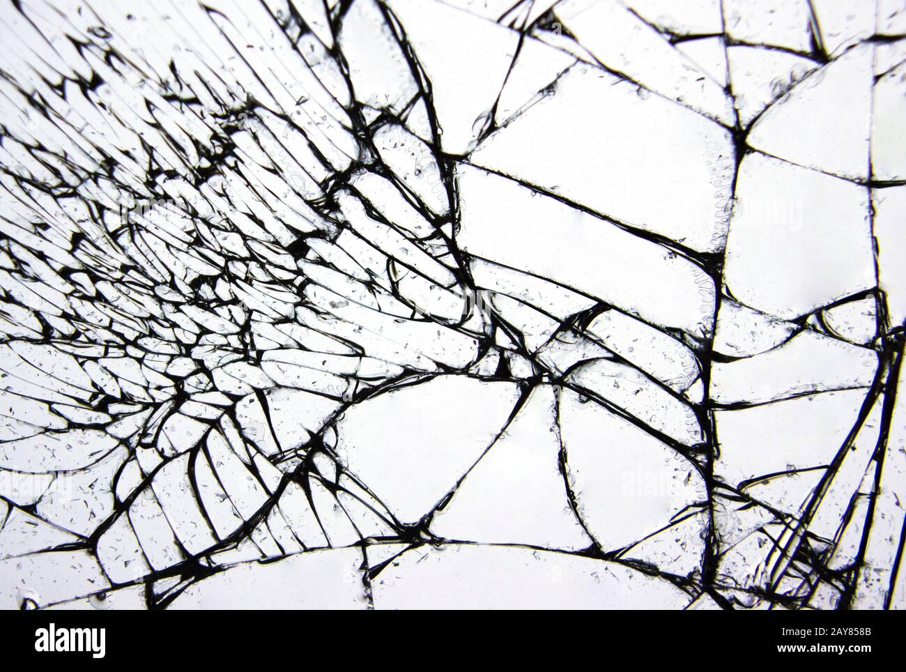 Cracks and lines on broken glass from impact Stock Photo - Alamy