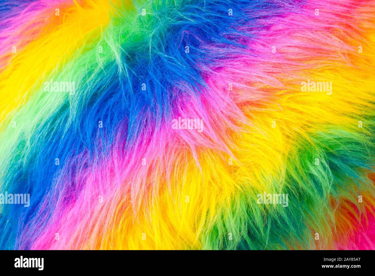 Flamboyant rainbow colored background of fuzzy fake fur Stock Photo - Alamy