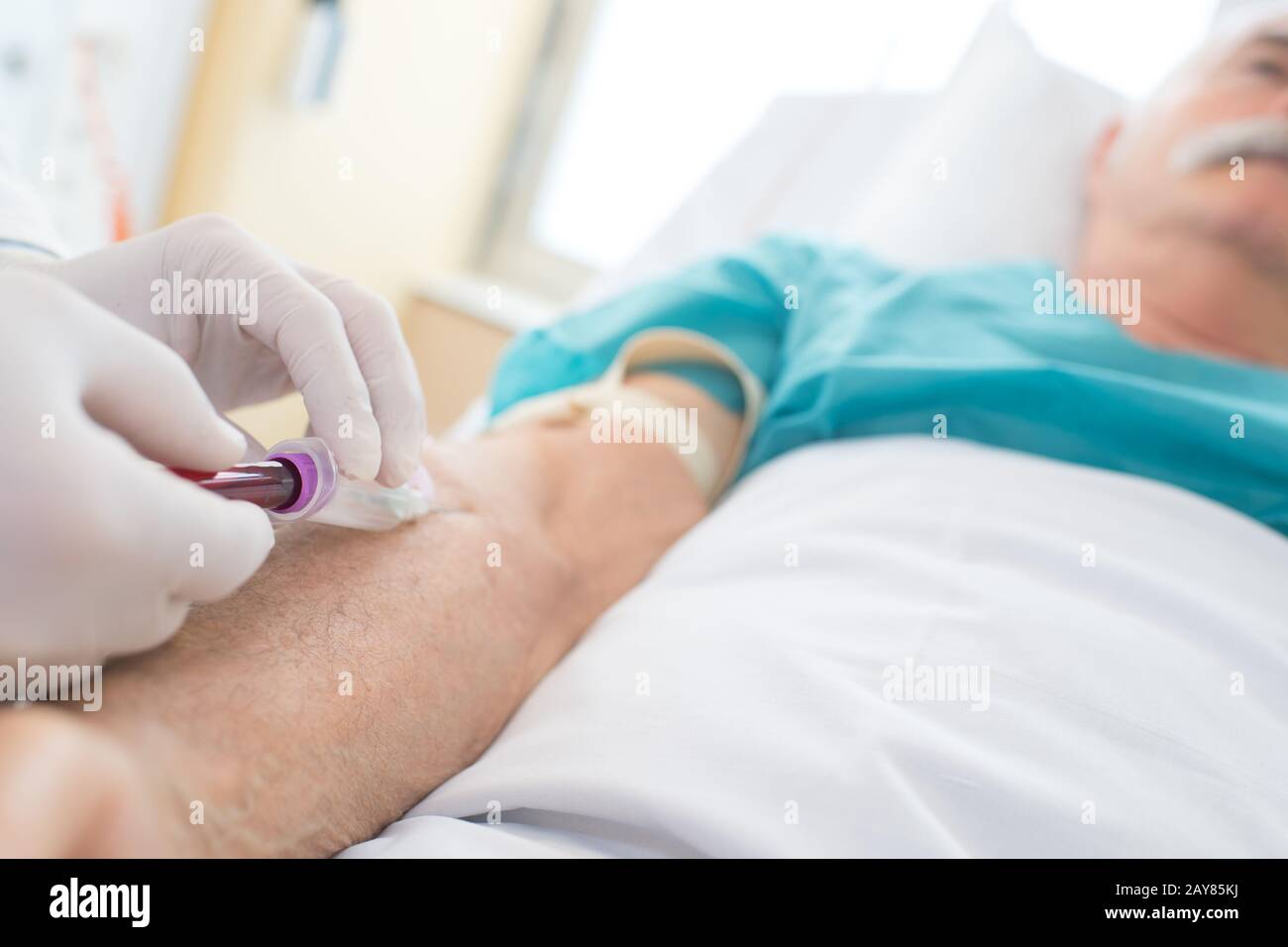 nurse giving an injection to a patient at the hospital Stock Photo - Alamy