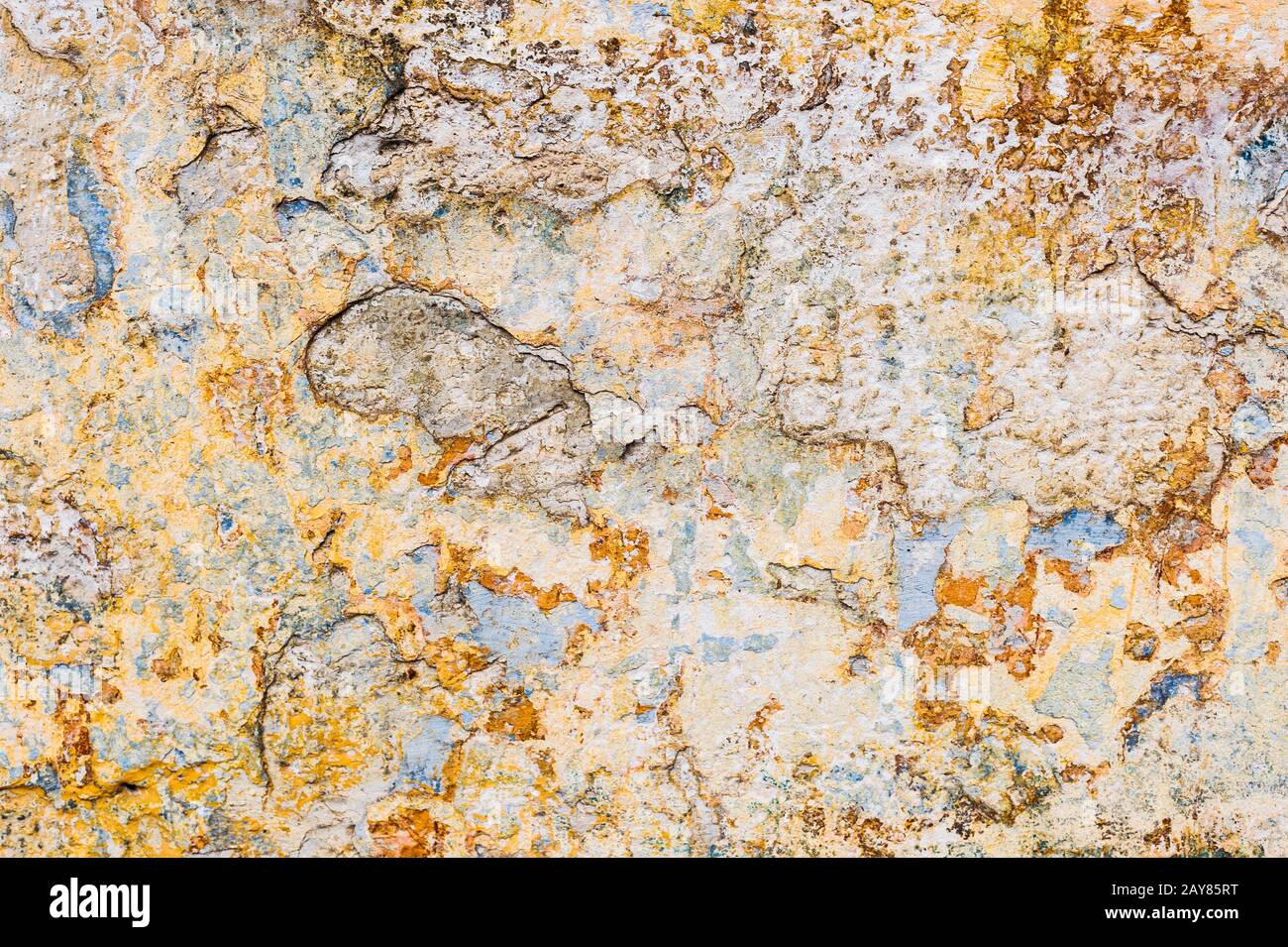 Textured background of multi-layer flaking paint on the wall. Mixing ...
