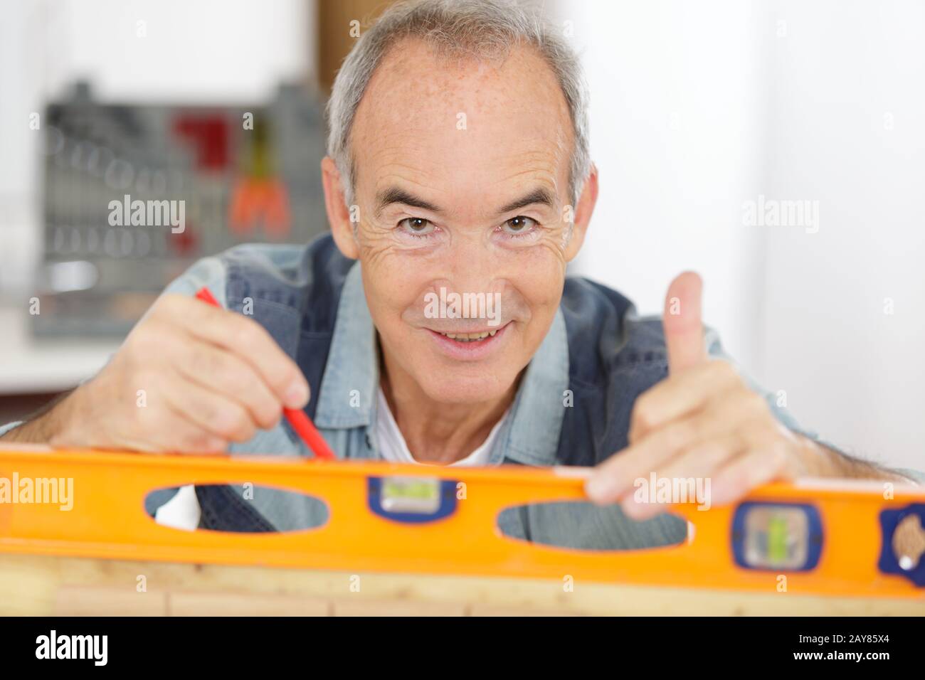 Retired man doing diy hi-res stock photography and images - Alamy