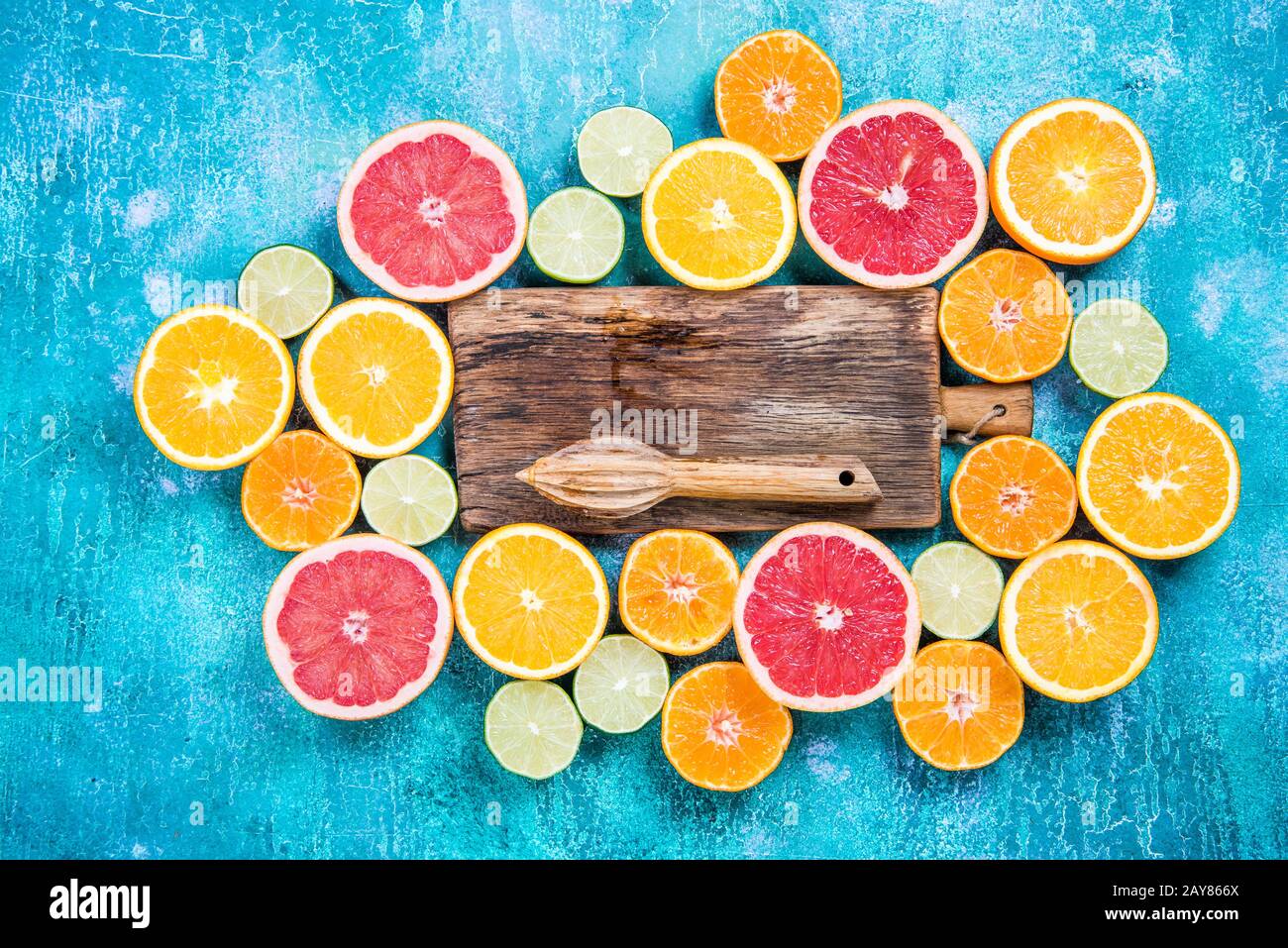 Halves of citrus fruits overhead, healthy eating Stock Photo - Alamy