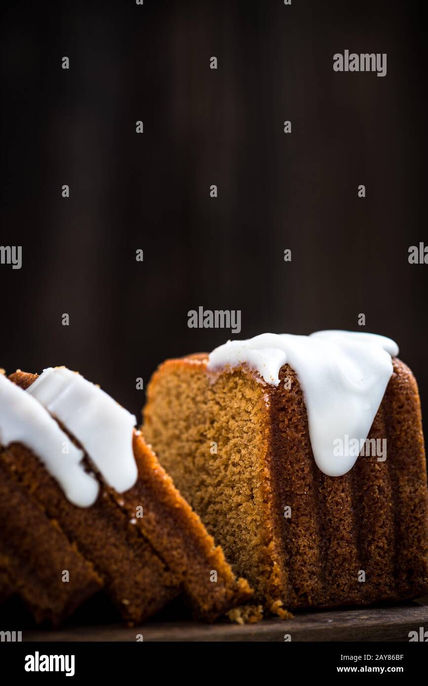 Slicing Easter cake for sharing with family Stock Photo - Alamy