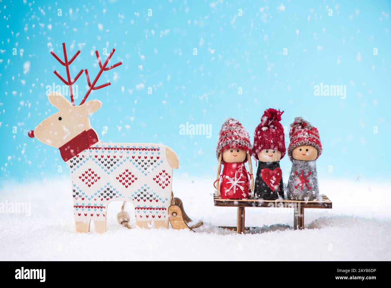 Happy and funny kids on snow sledge Stock Photo - Alamy