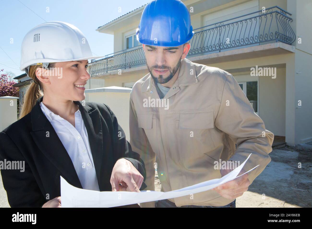 engineer builder woman and man outside site construction Stock Photo ...