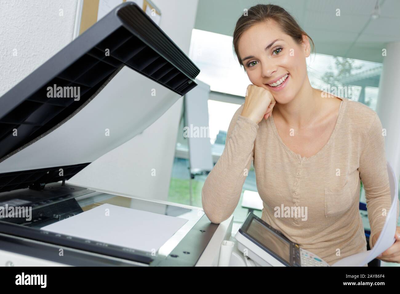 happy business lady using copier machine Stock Photo - Alamy