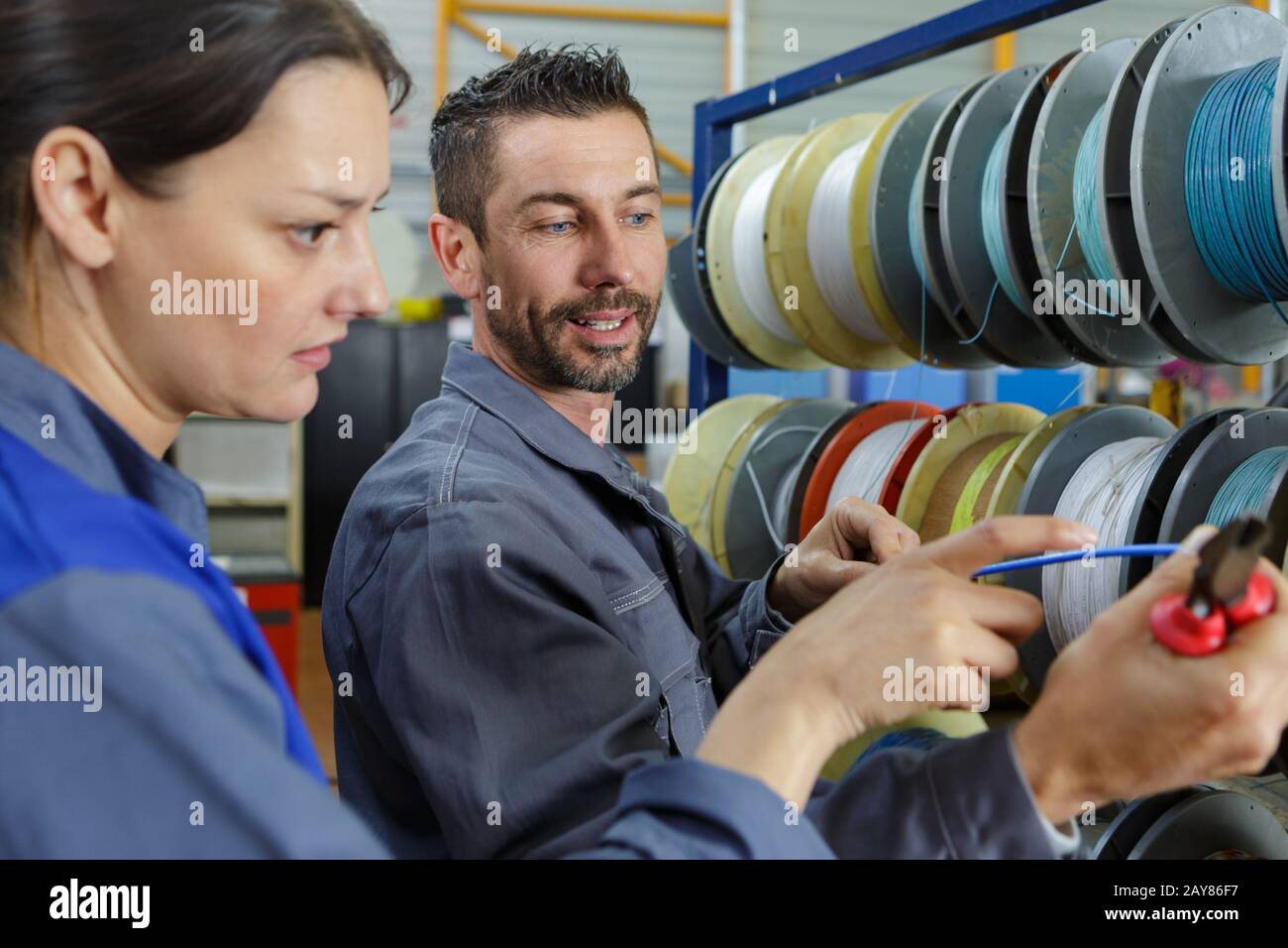 portrait of factory workers with cables Stock Photo - Alamy