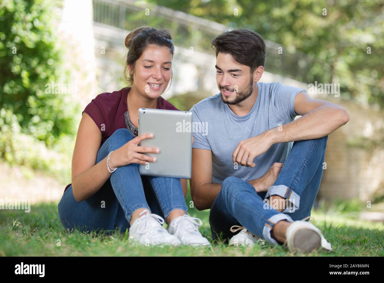 cute uni students studying together in nature Stock Photo - Alamy
