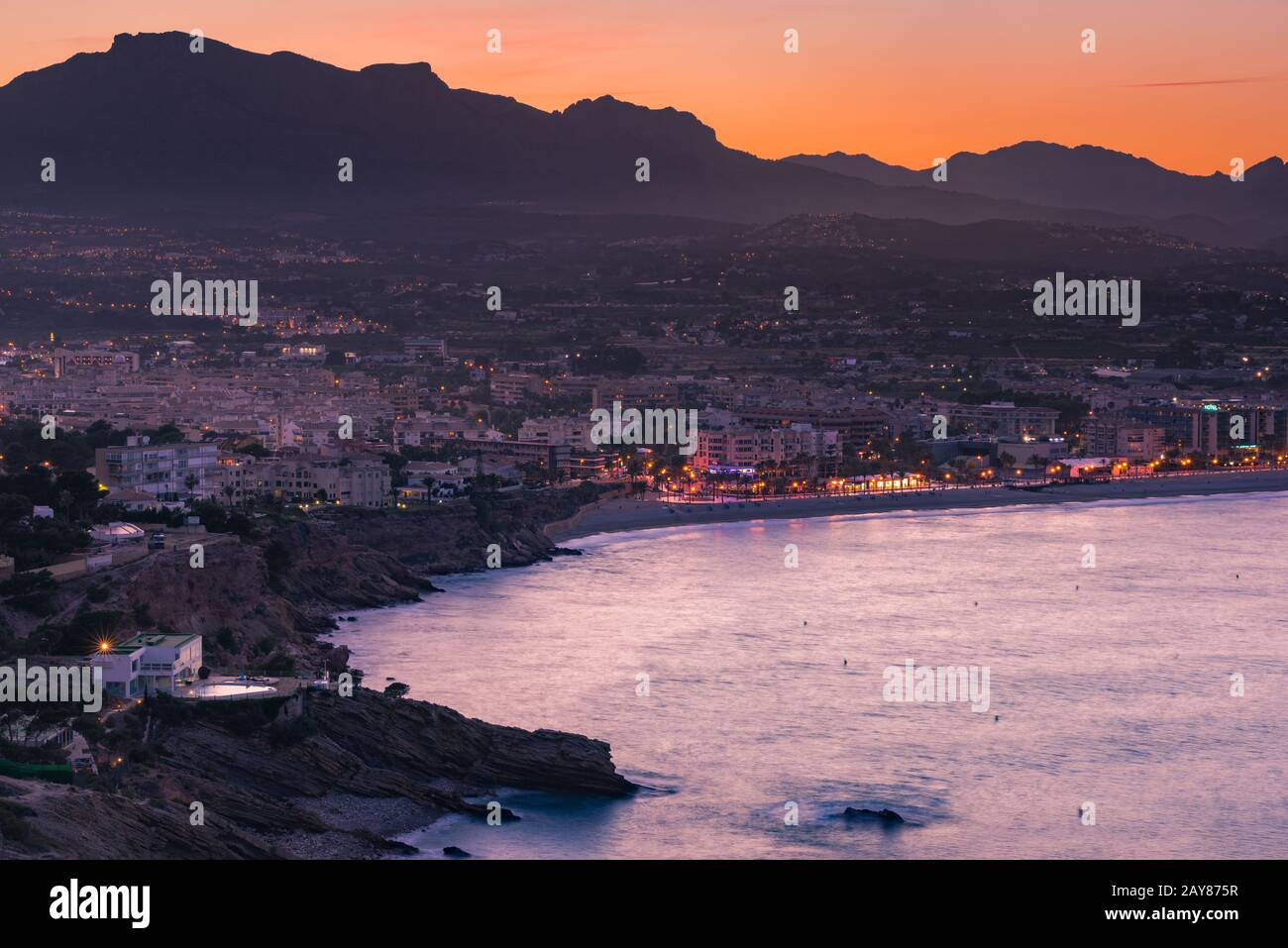 Illuminated Costa Blanca Albir town at twilight Stock Photo - Alamy