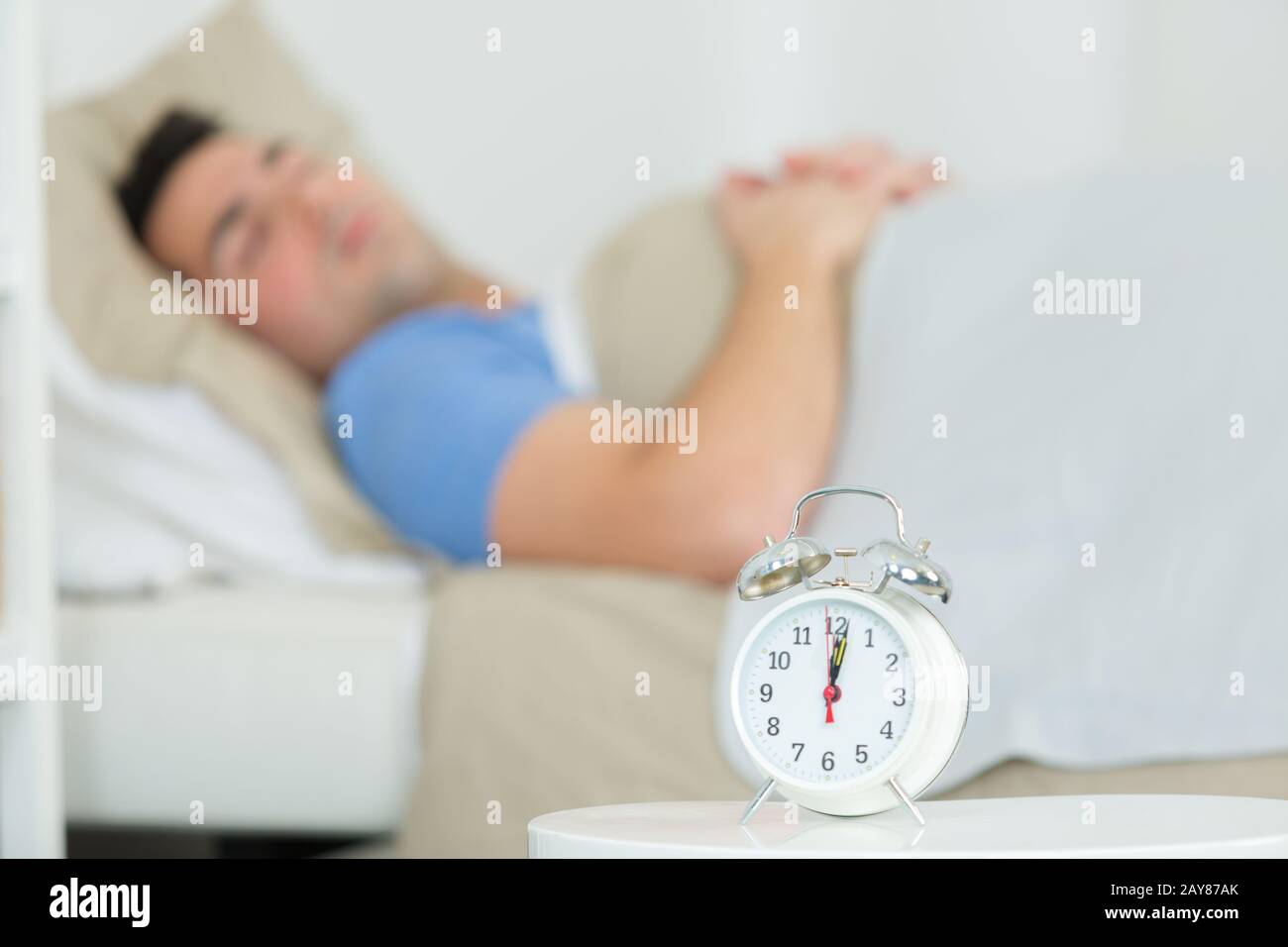 Frowning at alarm clock hi-res stock photography and images - Alamy