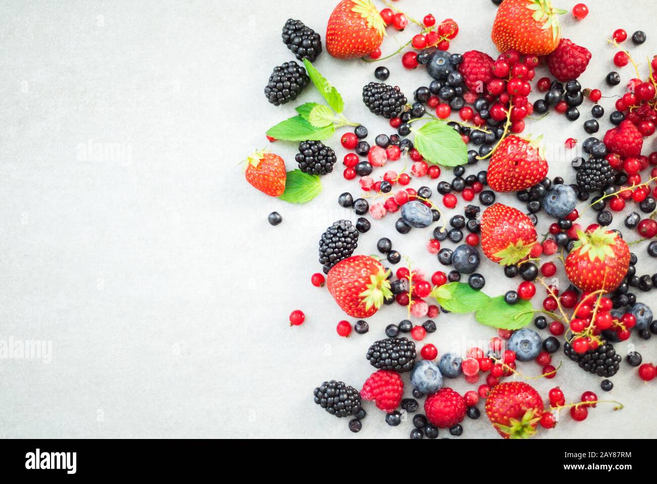 Fresh berry fruits border background Stock Photo - Alamy