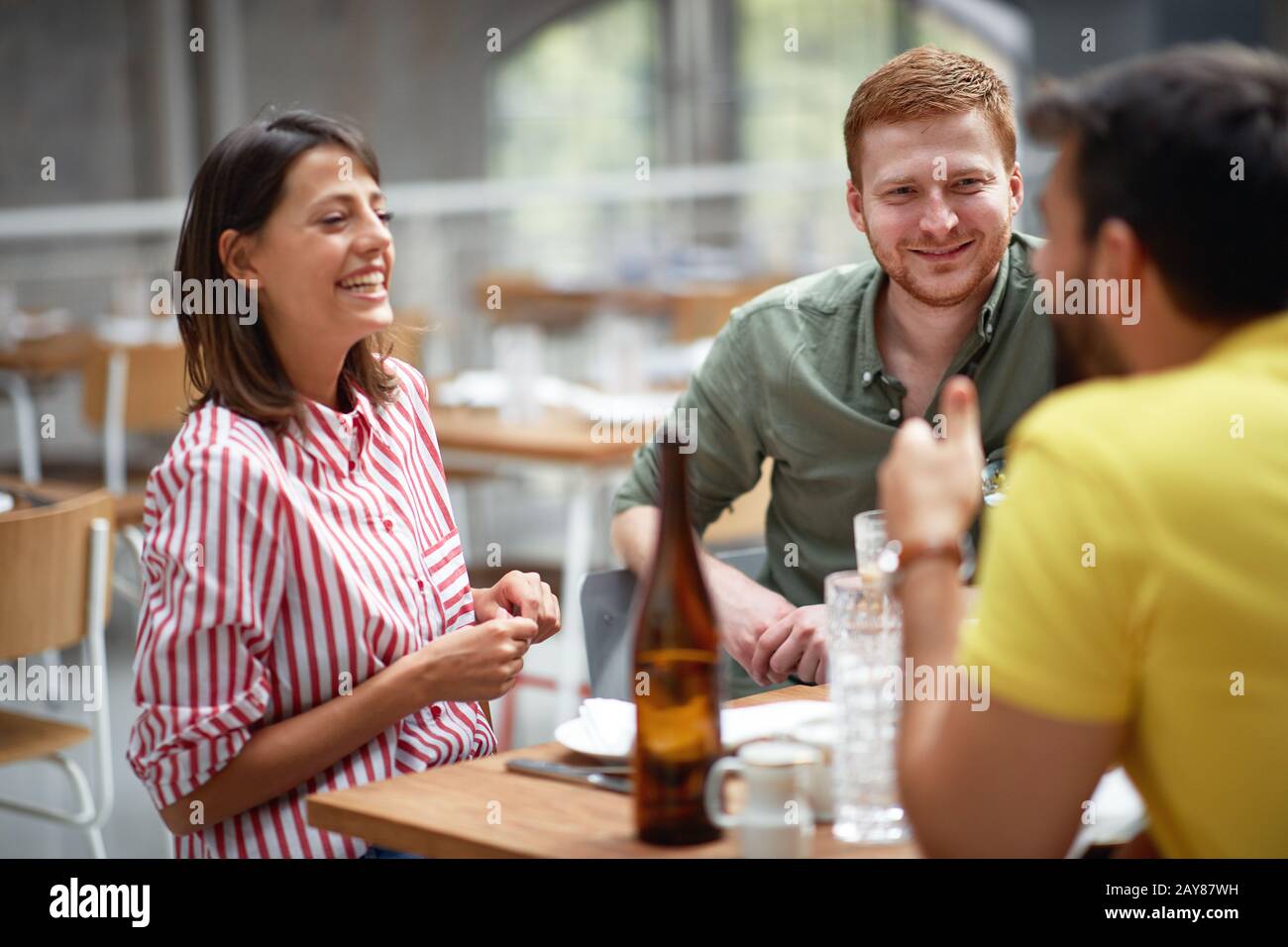 Women laughing restaurant table hi-res stock photography and images - Alamy