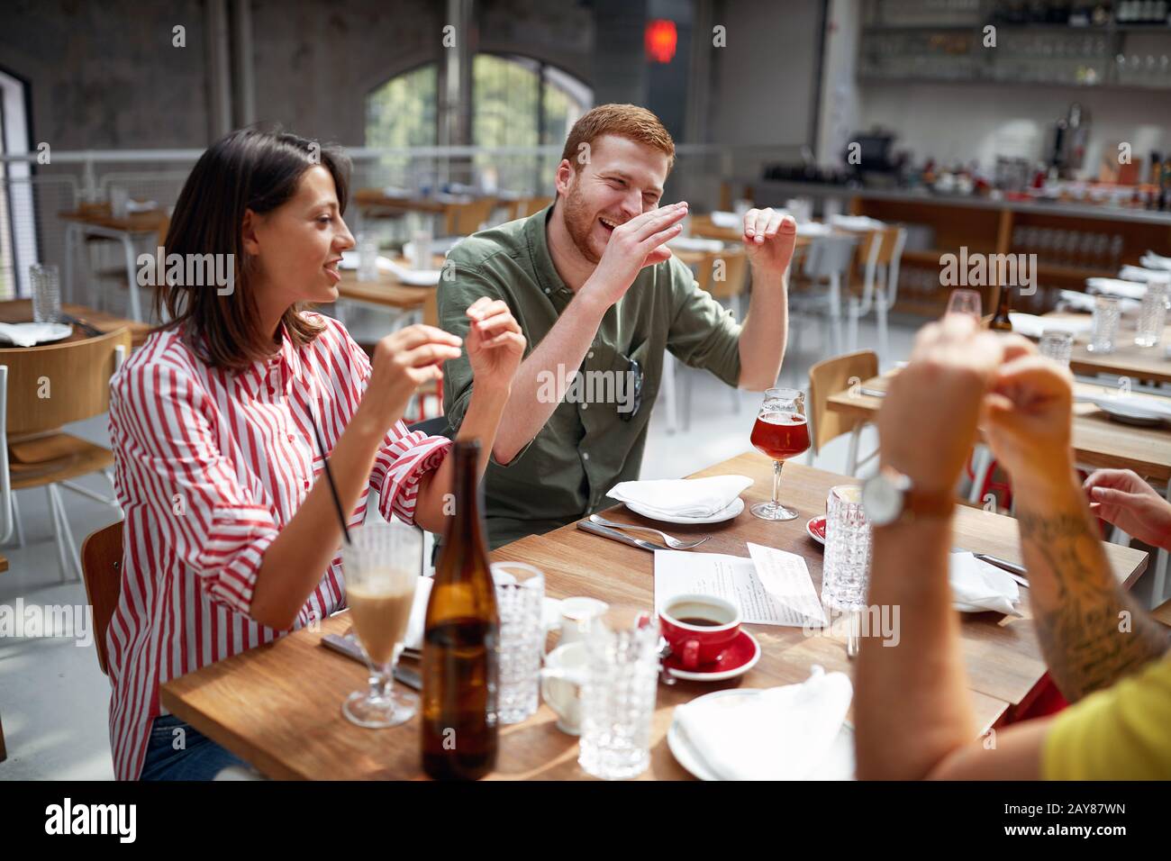 Women laughing restaurant table hi-res stock photography and images - Alamy