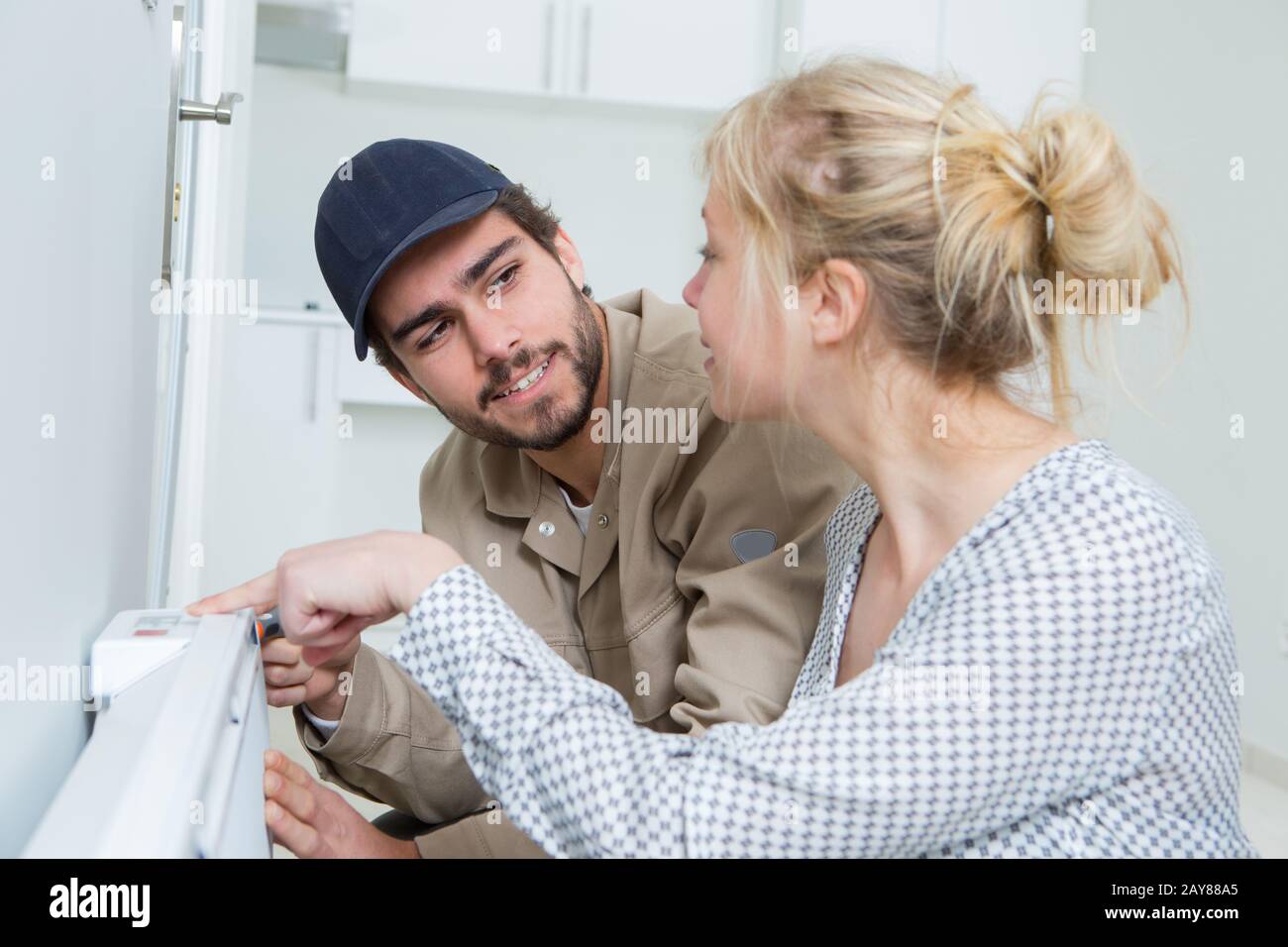 Professional plumber client fixing hi-res stock photography and images ...
