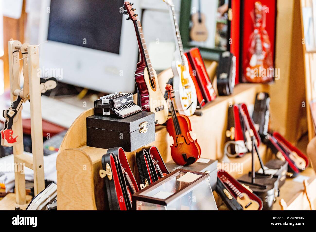 Miniature Guitars and other musical instruments as souvenir Stock Photo ...