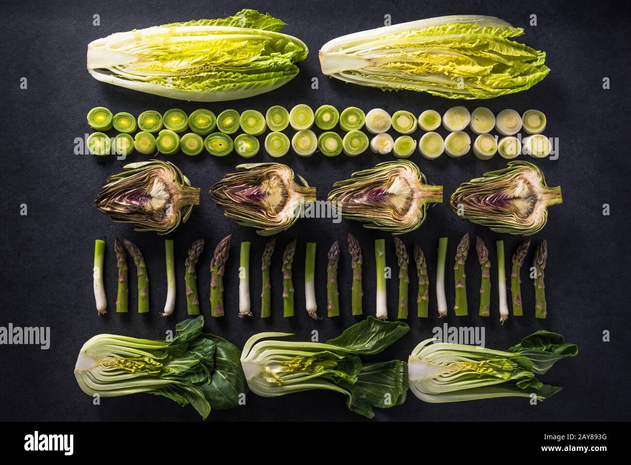 Green vegetables cut in halves, flat lay design Stock Photo - Alamy