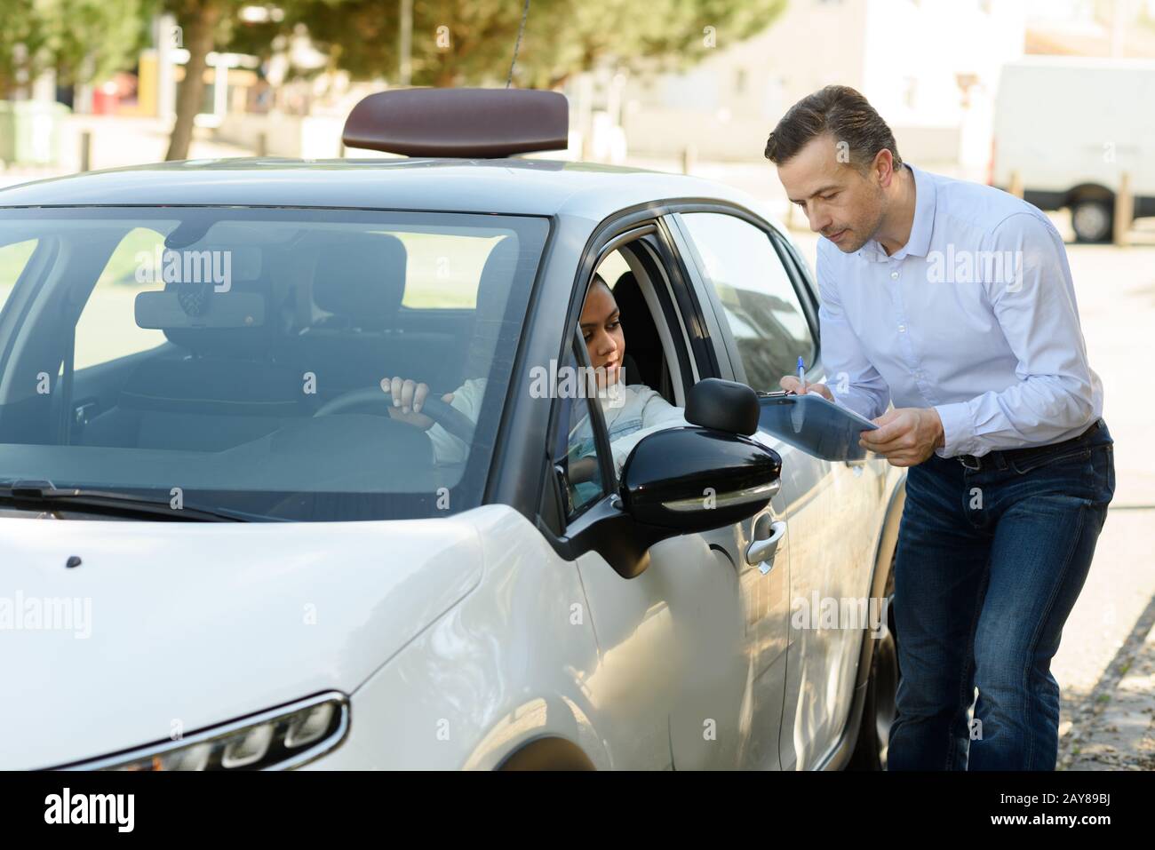 young female driver passing driving test Stock Photo - Alamy