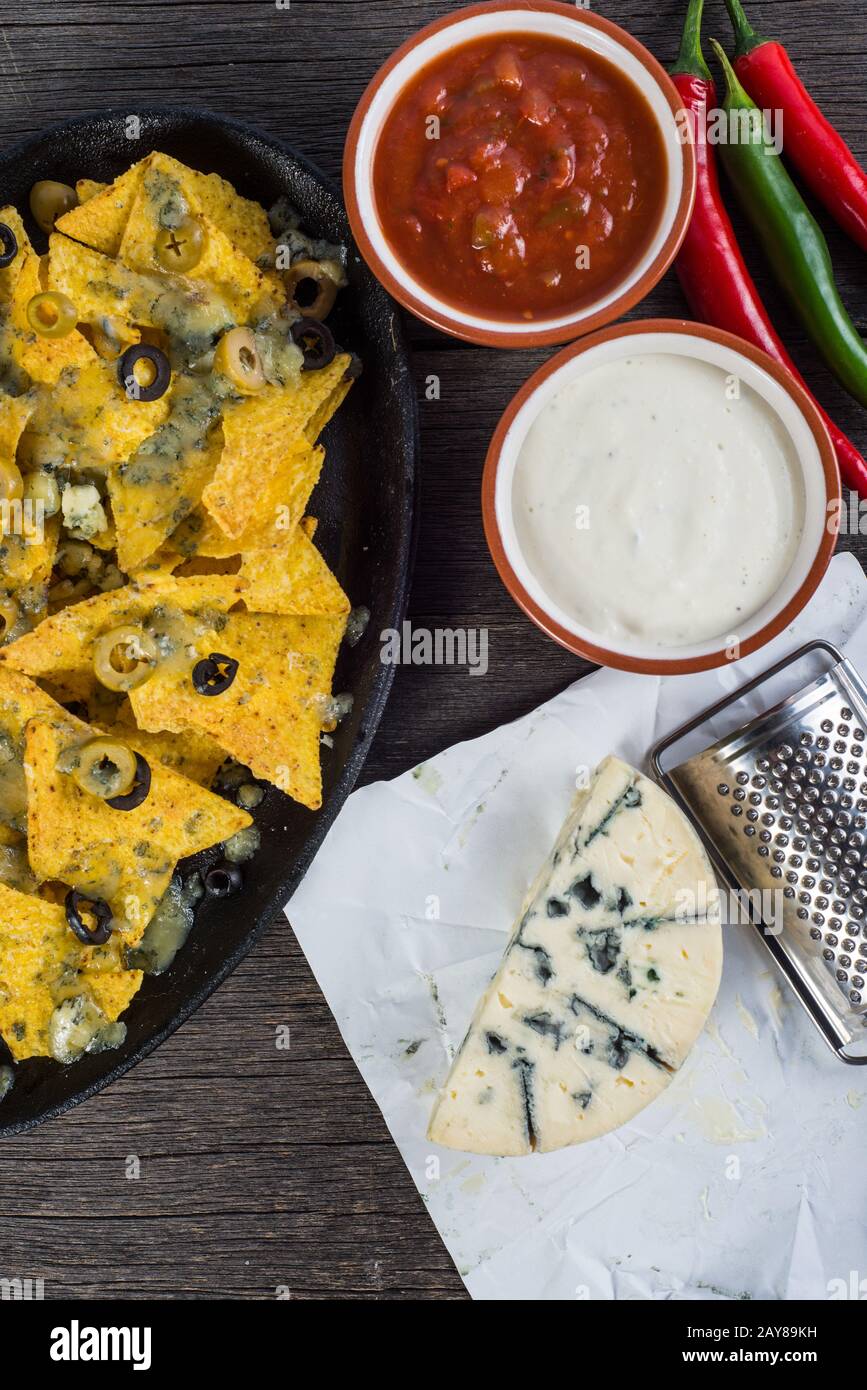 traditional nachos with cheese and salsa Stock Photo - Alamy