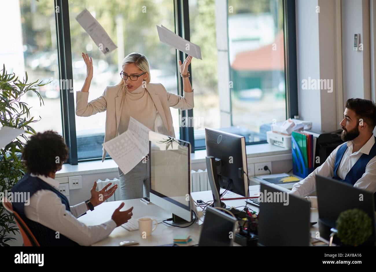 Woman papers throwing computer hi-res stock photography and images - Alamy