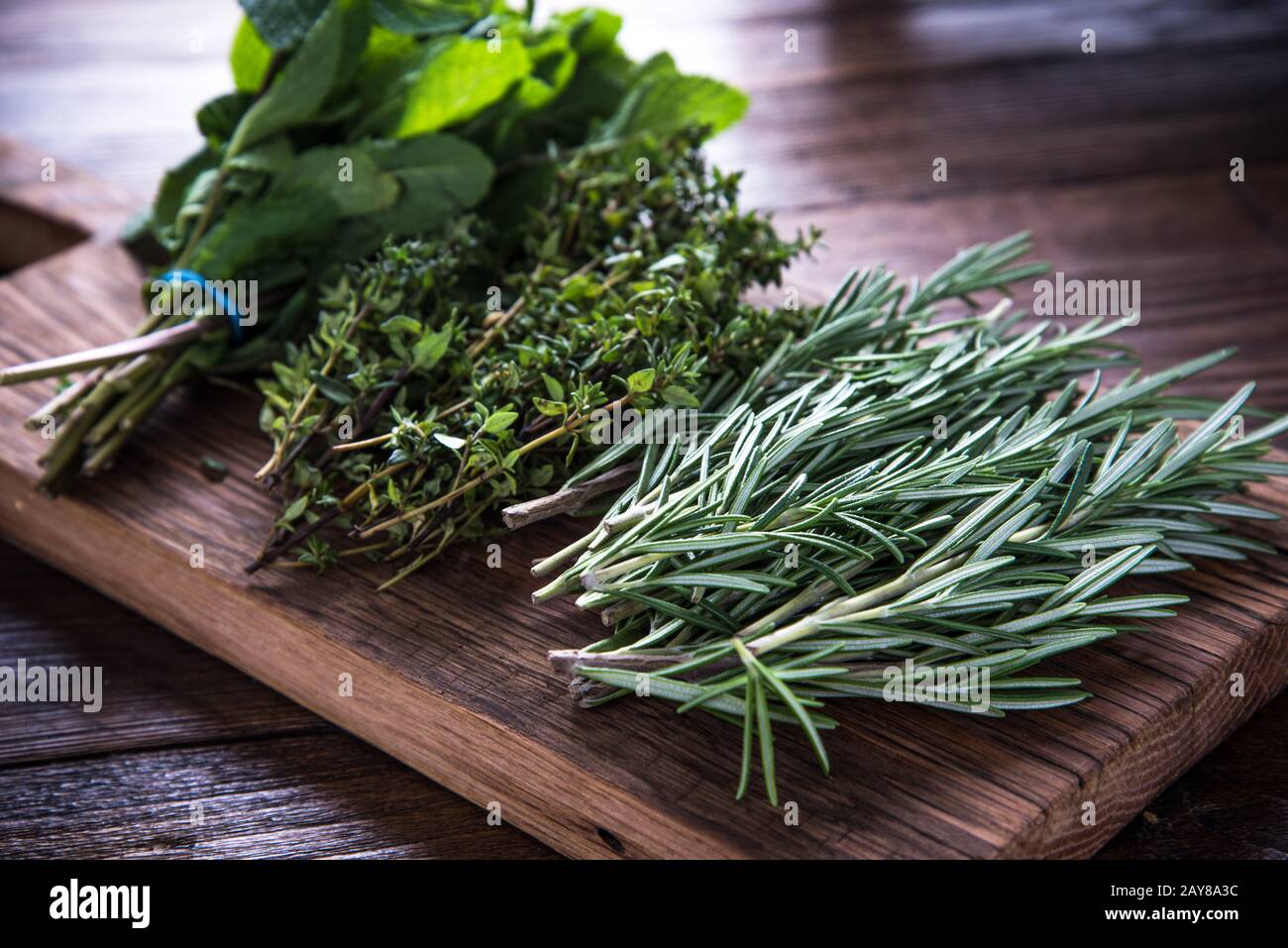 Various herbs on board hi-res stock photography and images - Alamy