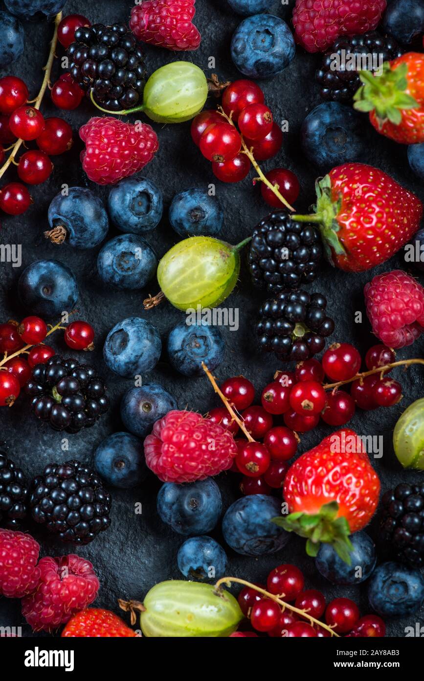 Mixed fresh ripe berries background Stock Photo - Alamy