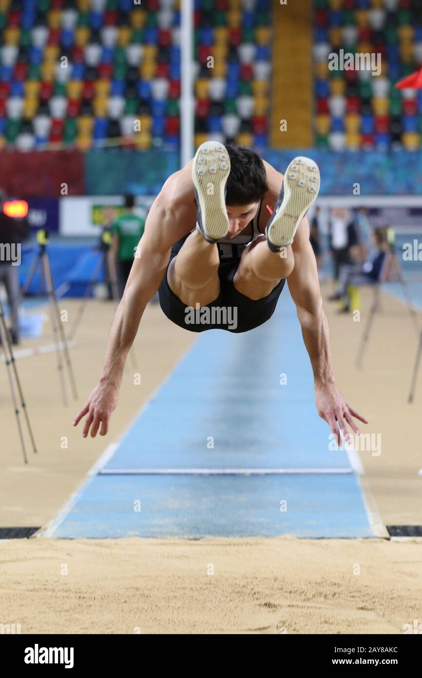 ISTANBUL, TURKEY - FEBRUARY 01, 2020: Undefined athlete long jumping ...