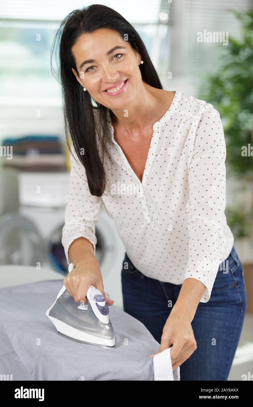 mature lady ironing clothes Stock Photo - Alamy