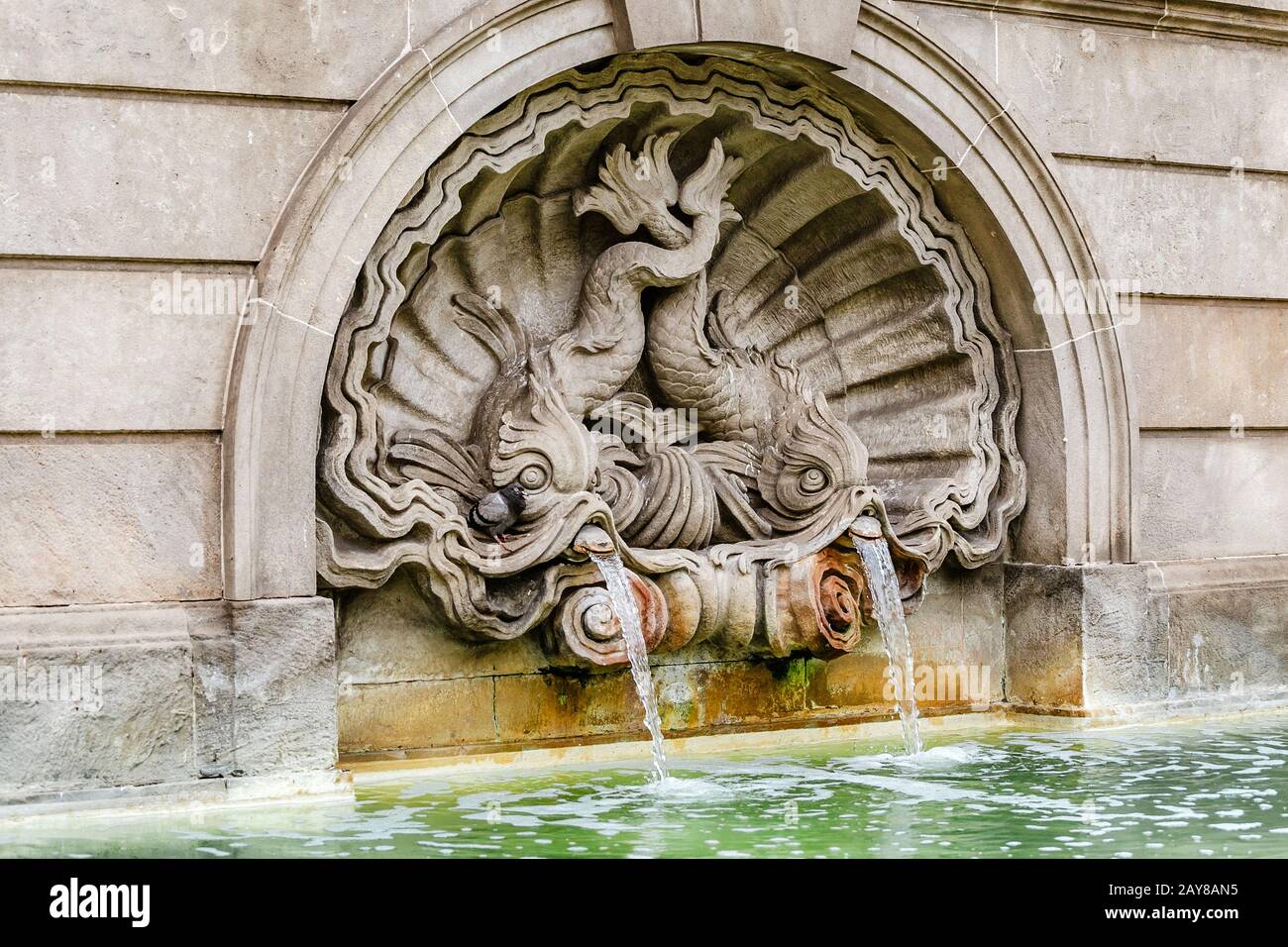 fountain with fish spouting water in Barcelona Stock Photo - Alamy