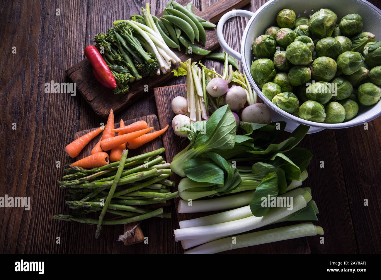 Fresh vegetables on cutting rustic boards Stock Photo - Alamy