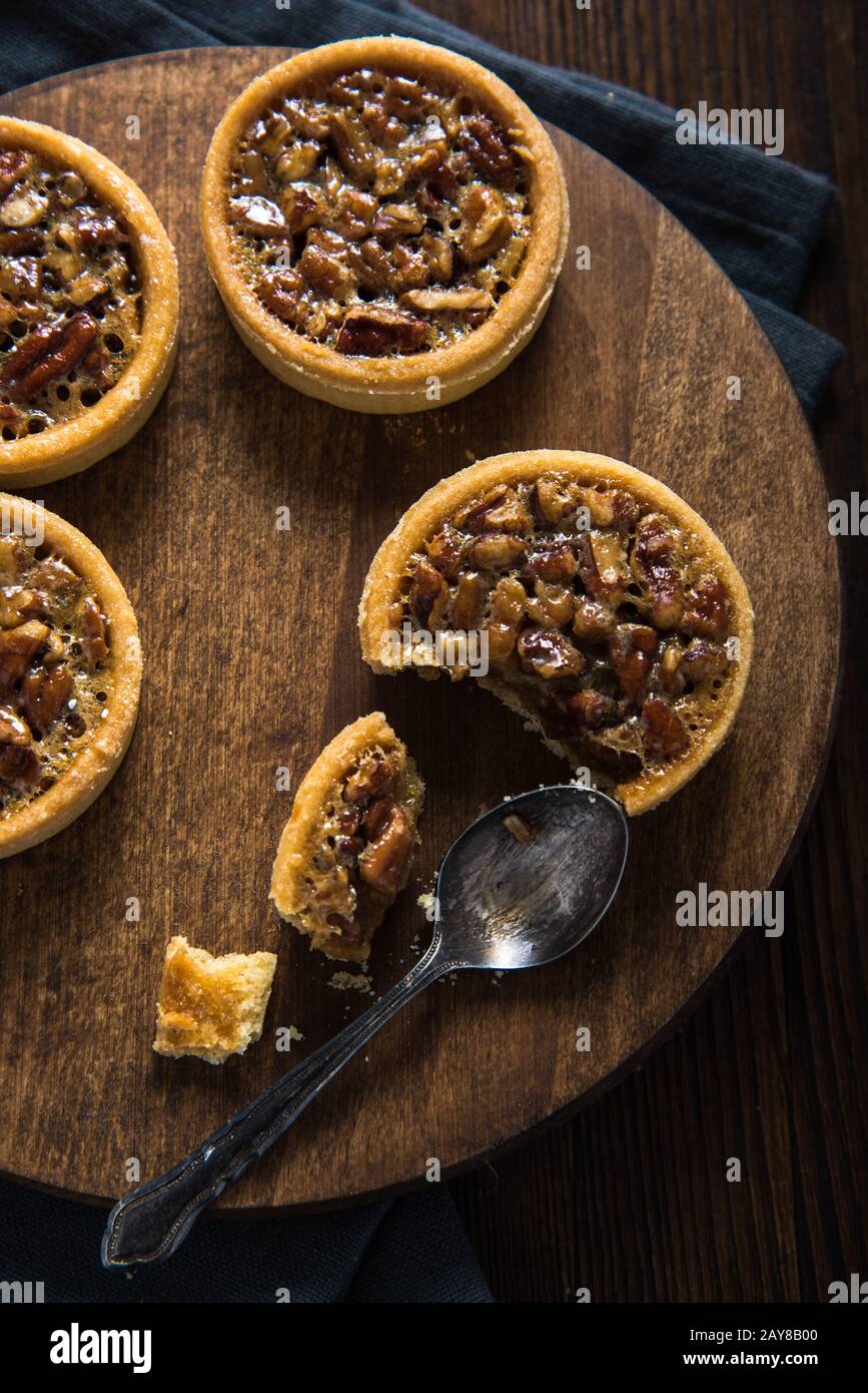 Hand decorated artisan pecan nut tarts Stock Photo - Alamy