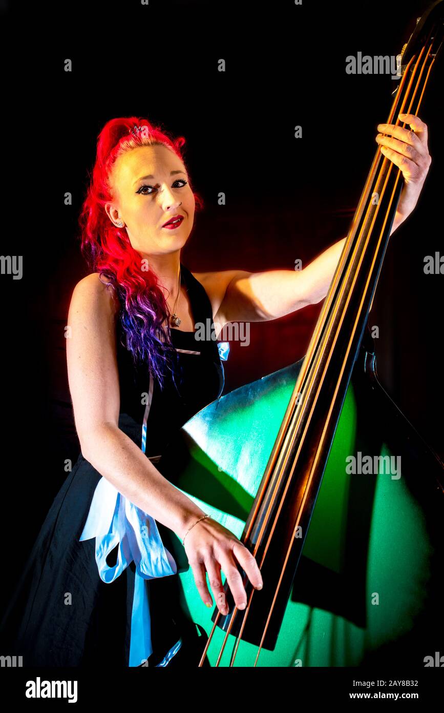 Female singer with red hair and double bass Stock Photo - Alamy