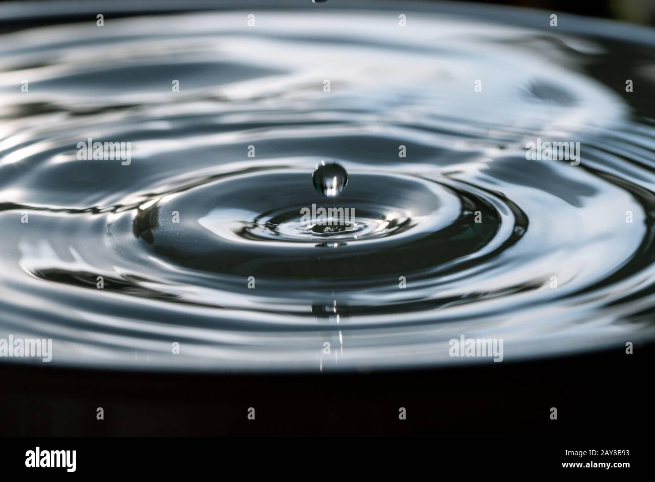 Water Drop splash with sun Stock Photo - Alamy