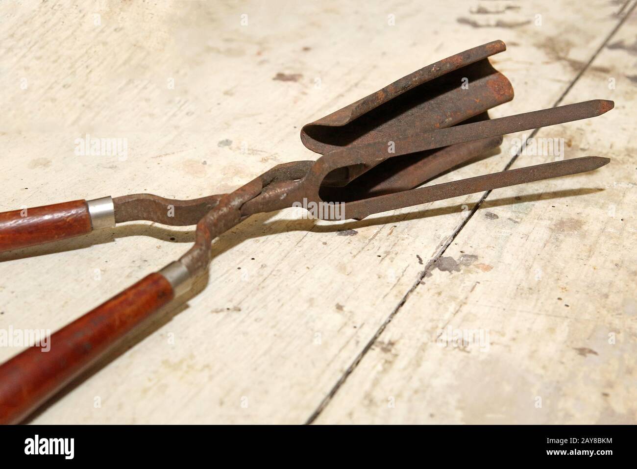 old curly iron Stock Photo - Alamy