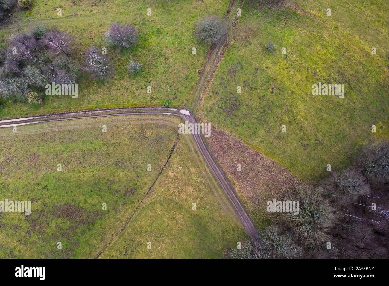 tractor path in the winter from above with a curve from far above Stock ...