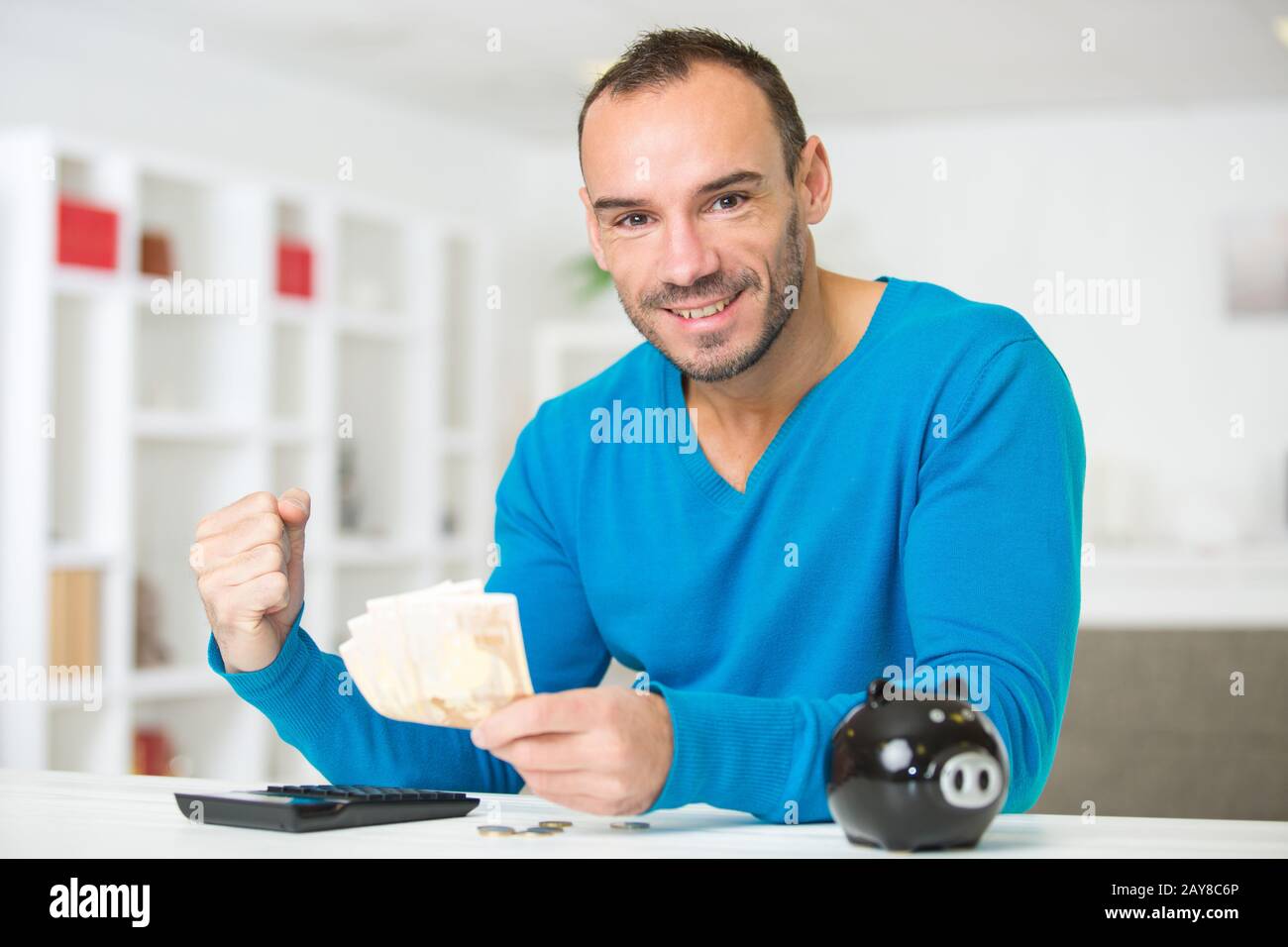 happy man as he managed to save money Stock Photo - Alamy