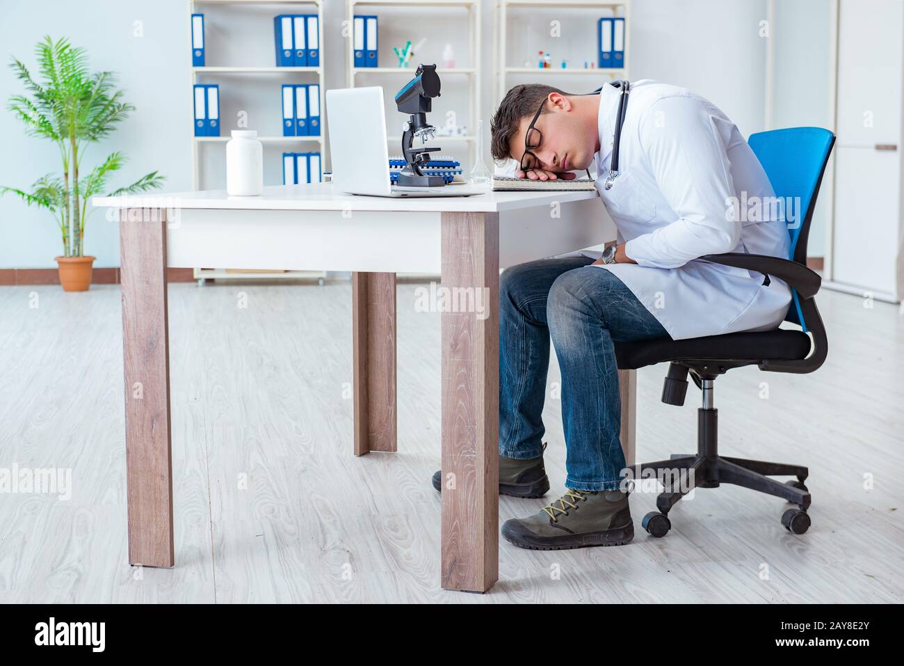 Tired doctor after night shift Stock Photo - Alamy