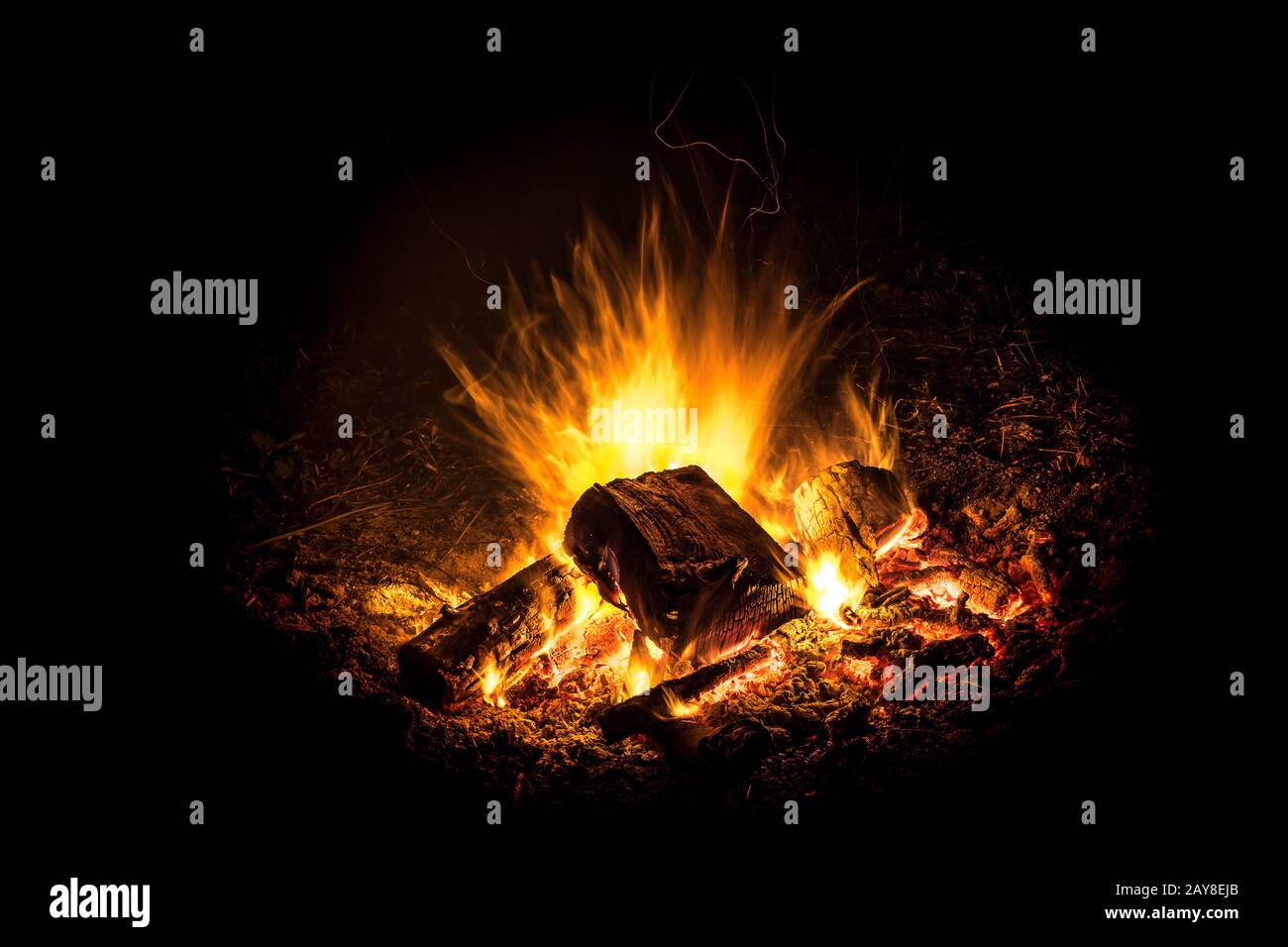 Bright burning fire with embers in front of black background Stock ...